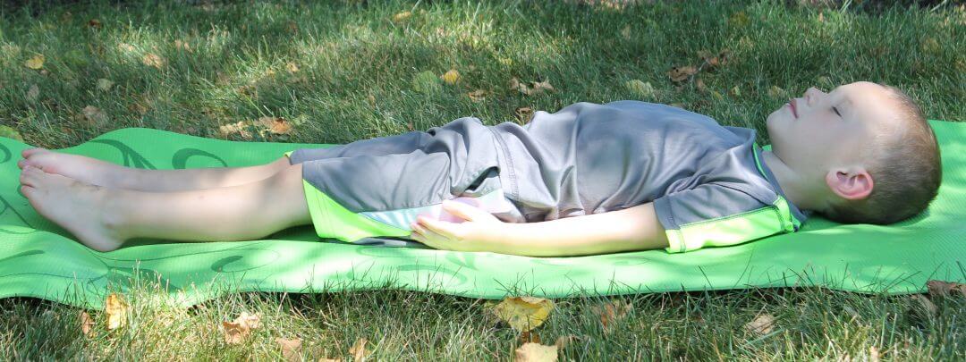 What Savasana Looks Like in for Kids in Yoga: Kids Yoga Lesson Planning 101